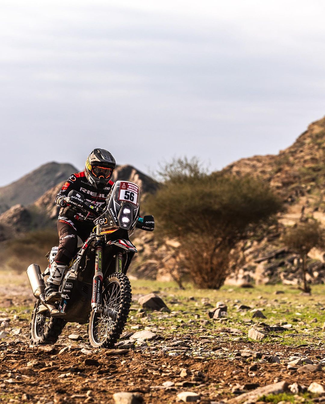 Women racing over rocks, mountain tracks, and climbing to altitude of ...